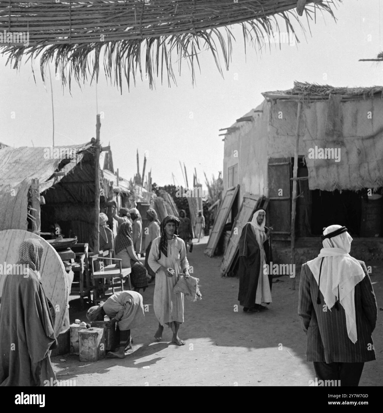 Qatar - 1954 PICTURE SHOWS: Scene in the Suq or market-place of Doha ...