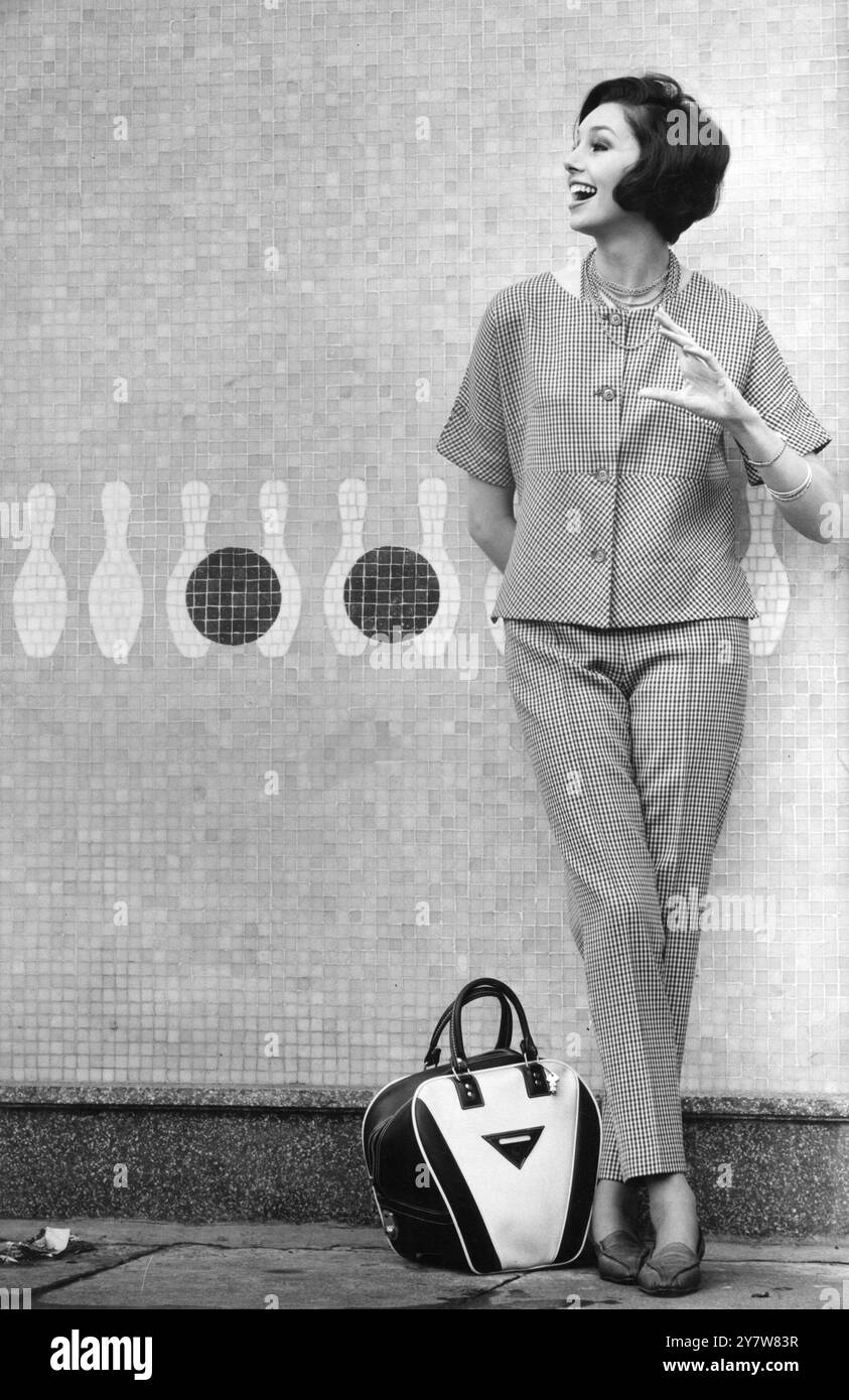 THE BOWL-'EM OVER SUITA woman waits for her friends outside the ten pin ...