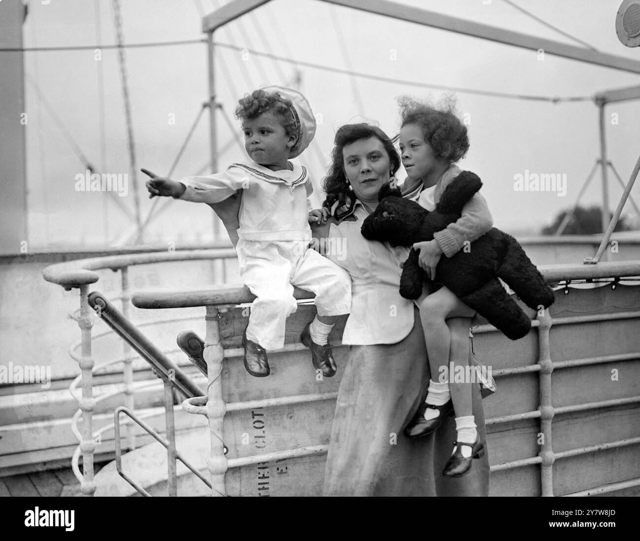 Mrs Eileen Johnson, 24, seen with her two children, Terence, aged three ...