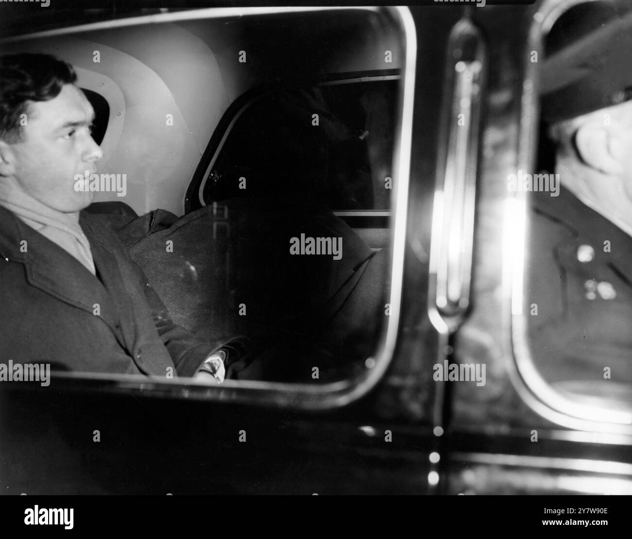 A car dashes from the Eastbourne Police Station, following the ...