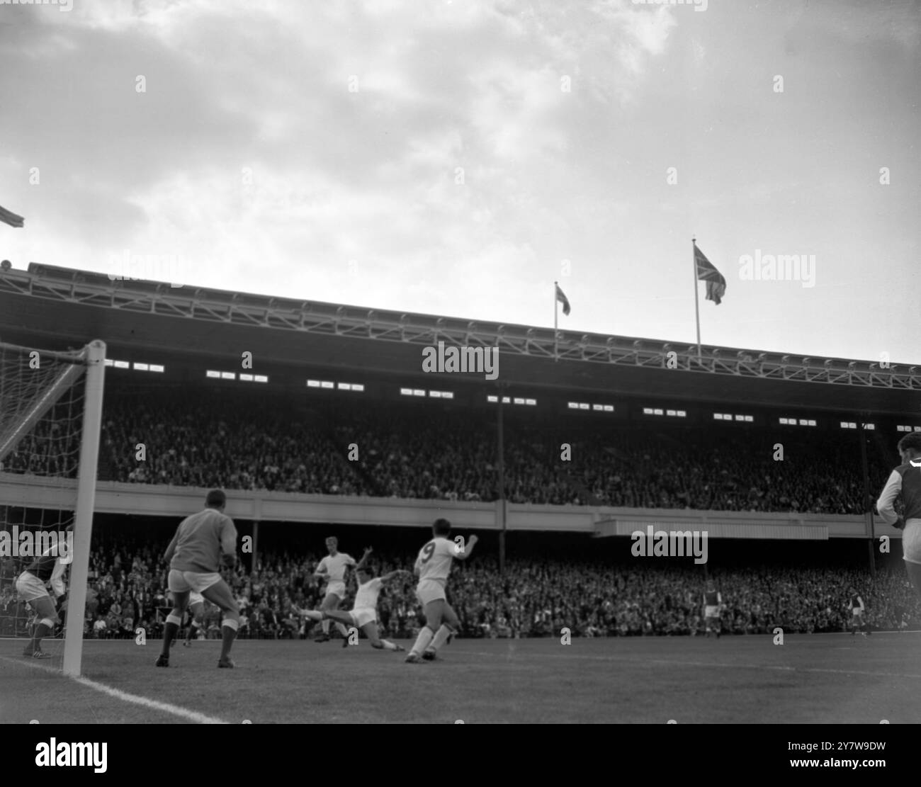 Sunderland's inside right , George Herd stretches out his foot and just ...