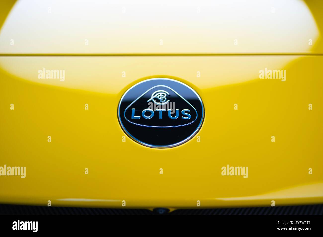 advertising logo yellow Electric Hyper-GT Lotus Emeya in showroom ...