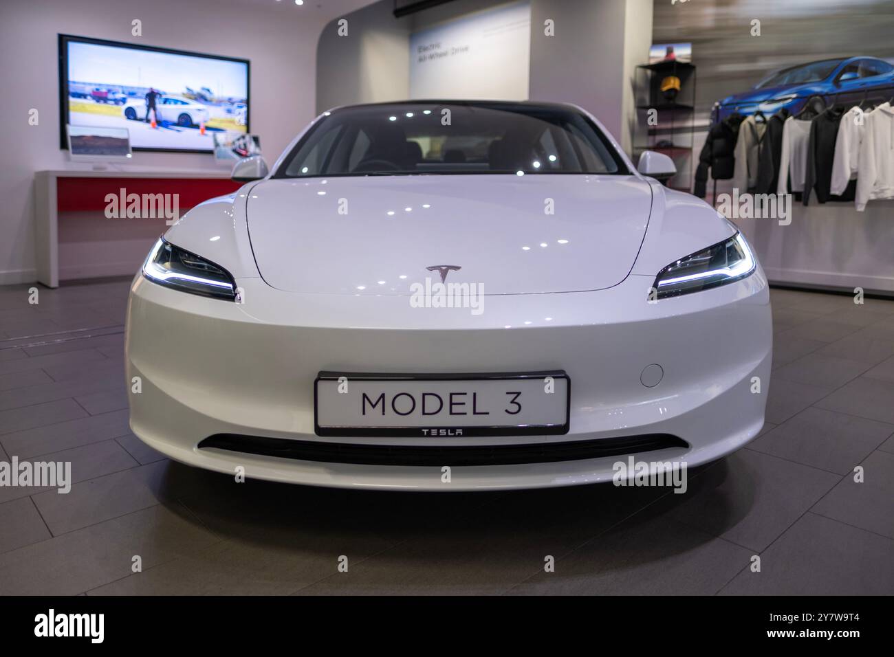 white electric Tesla car model 3 in auto store, tesla motors Elon Musk ...