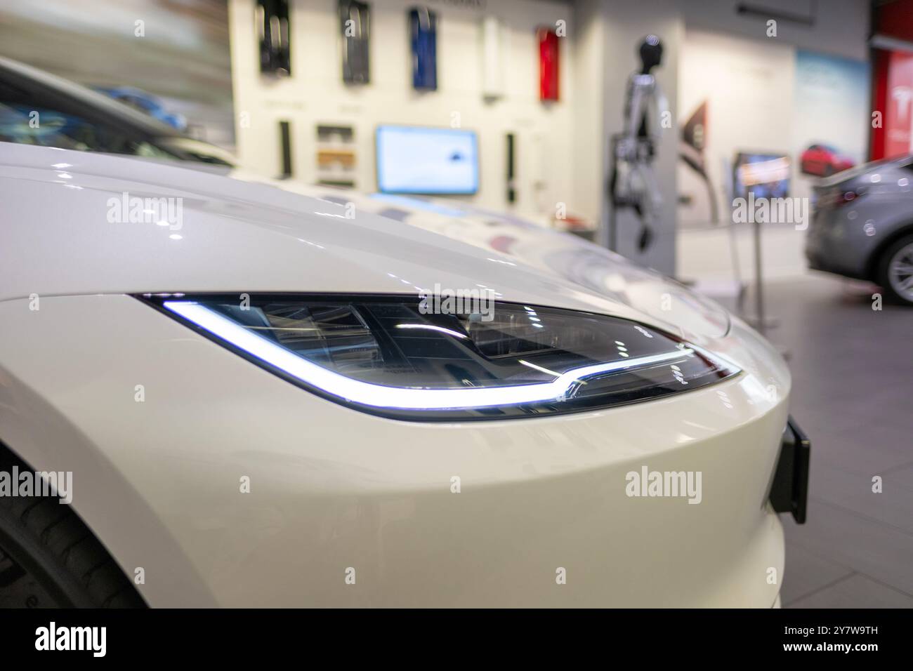 white electric Tesla car model 3 in auto store, tesla motors Elon Musk ...