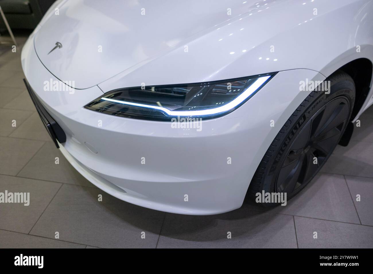 white electric Tesla car model 3 in auto store, tesla motors Elon Musk ...
