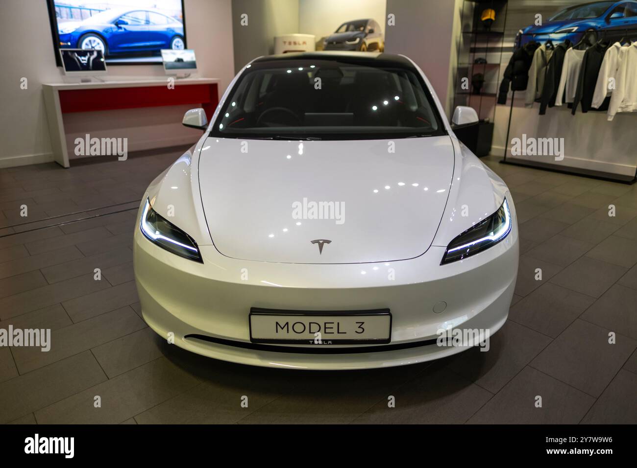 white electric Tesla car model 3 in auto store, tesla motors Elon Musk ...