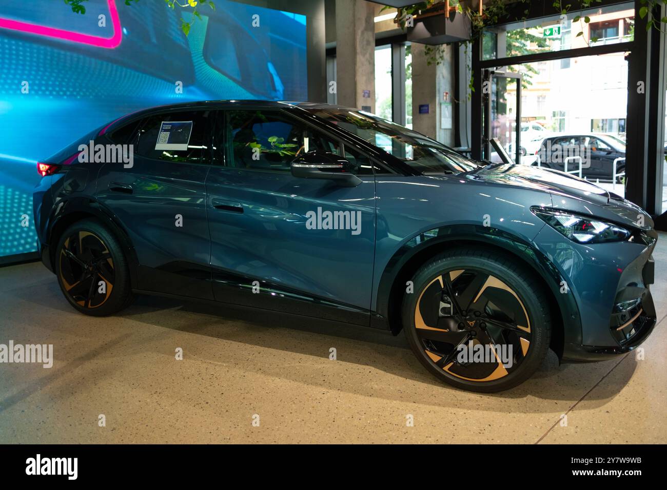 blue fully electric Cupra Tavascan, Spanish compact crossover SEAT ...