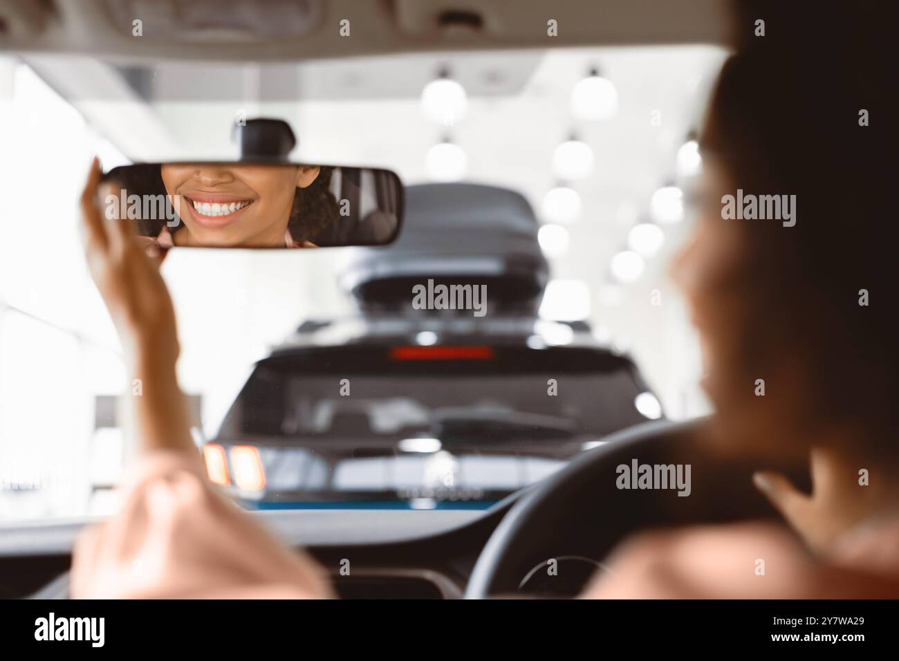 Unrecognizable Woman In Driver's Seat Checking Mirrors In Dealership ...