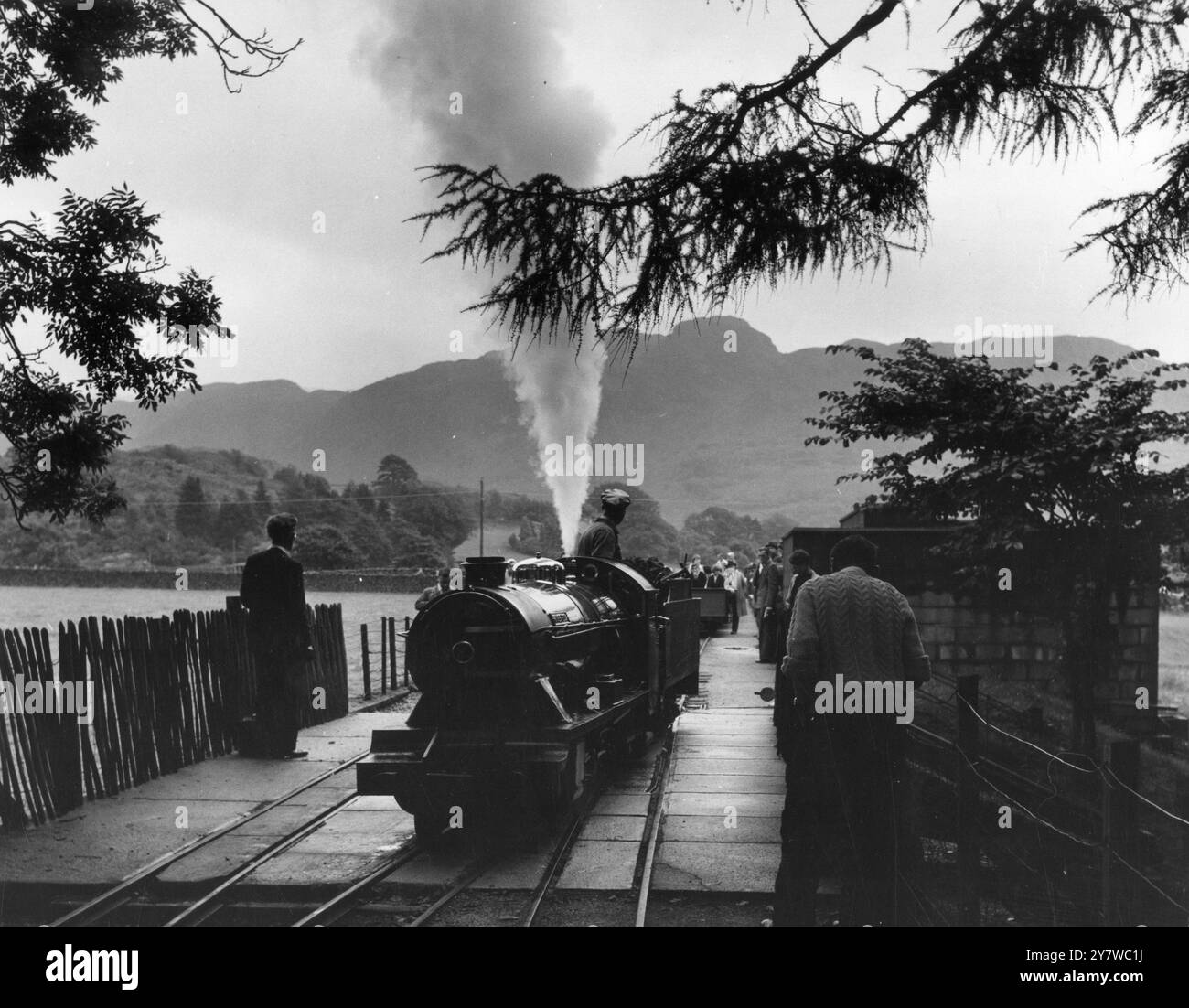 The narrow gauge Ravenglass and Eskdale railway , Cumberland - Photo shows: The train picking up ...