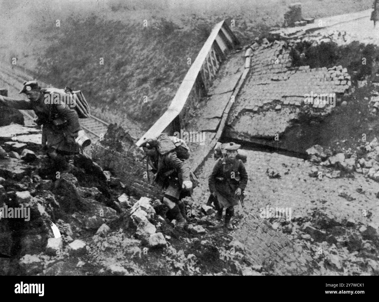 On the Western Front : Highlanders coming over a railway bridge after ...
