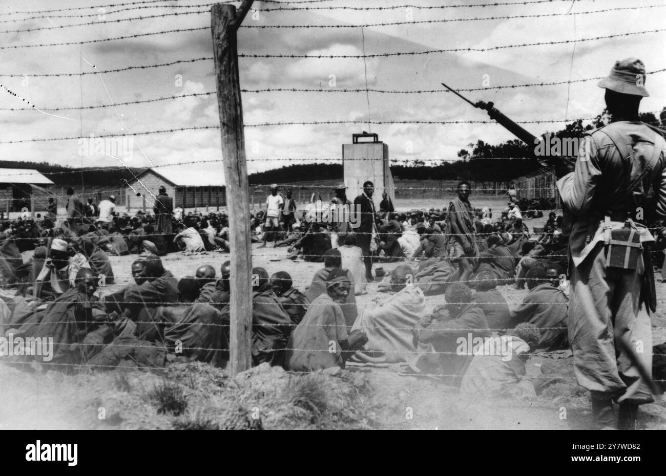 Next to the Gallows Kikuyu tribesmen sit in Thomson's Falls prison ...