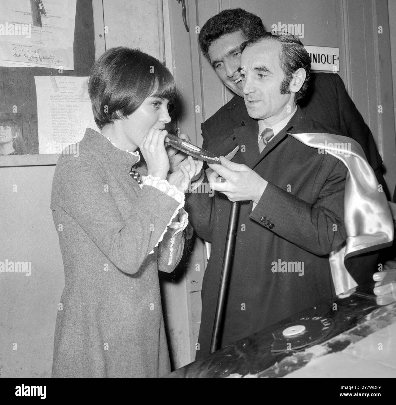 French singer Mireille Mathieu shares a record shaped cake with French ...
