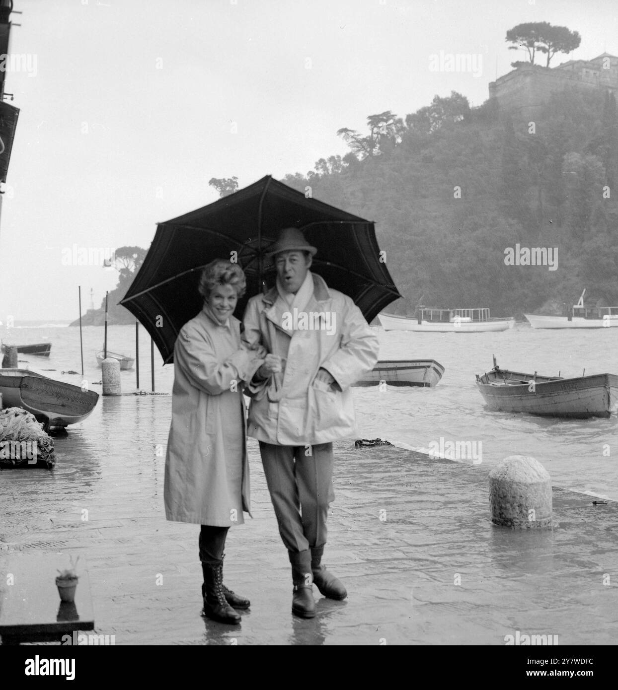 Rex Harrison and his actress wife Rachel Roberts pause for a picture as ...
