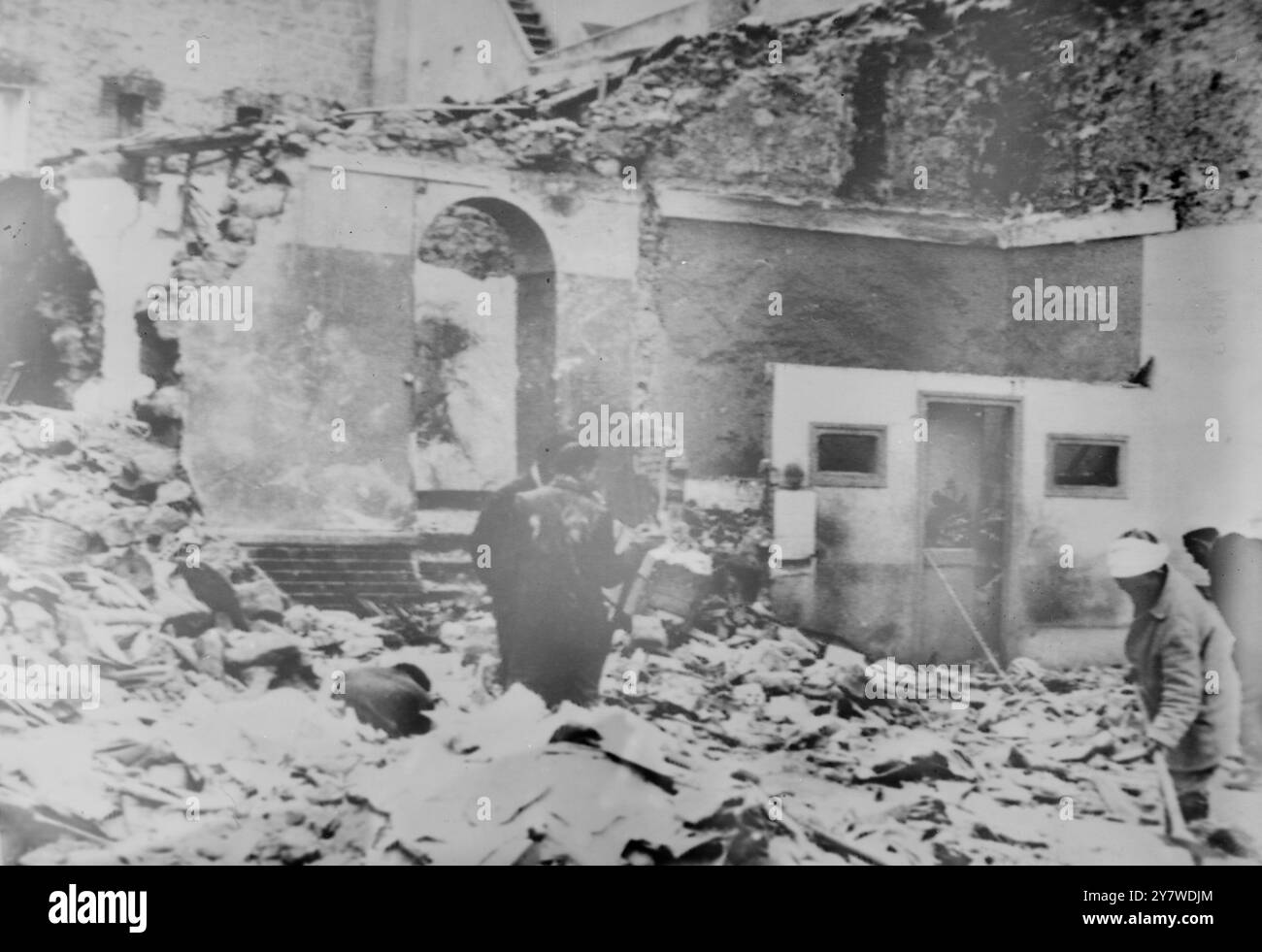Muslim rescuers search the ruins of a baker's shop after a rebel bomb ...