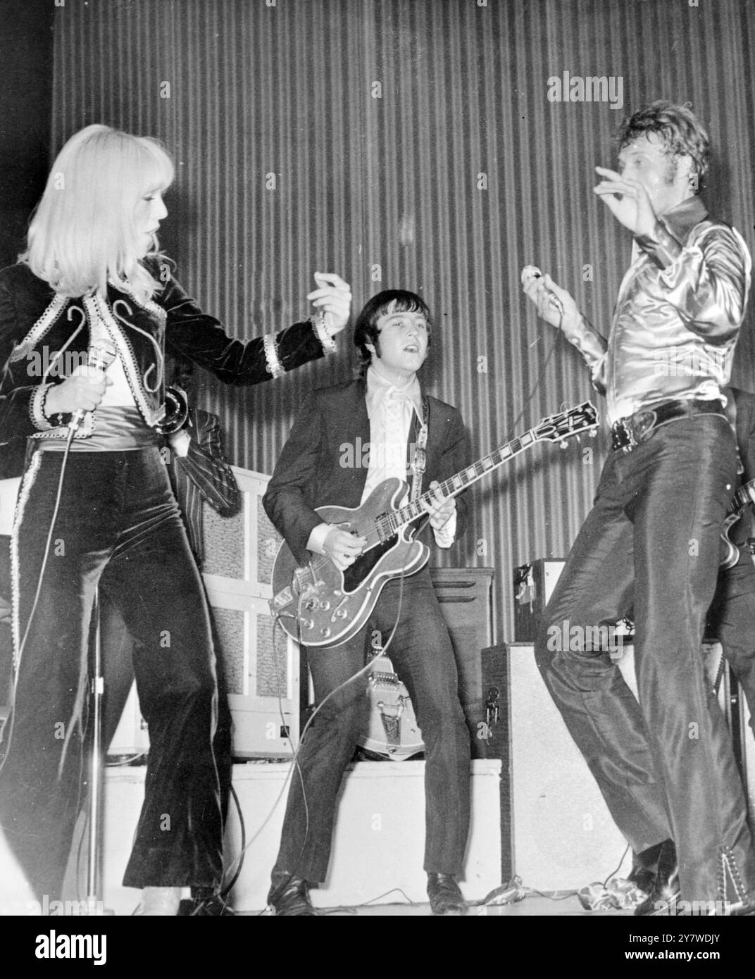 Paris : French pop singer Johnny Hallyday ( right ) and Sylvie Vartan performing at Premiere at ...