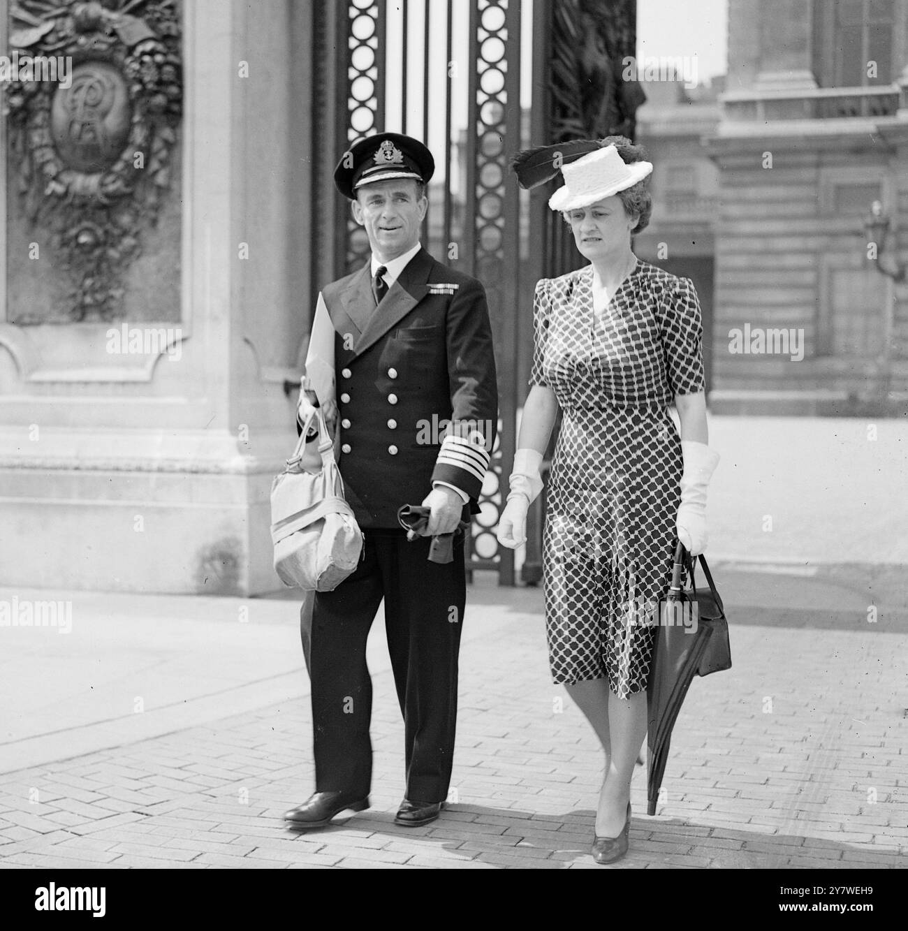 Investiture at Buckingham Palace . Captain Michael Denny , R N , C B ...