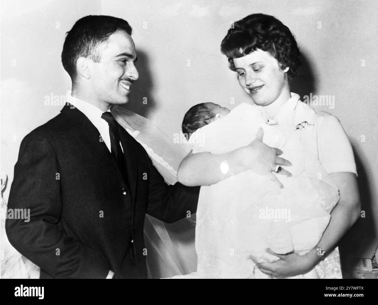 A happy King Hussein of Jordon looks on as his British born wife ...