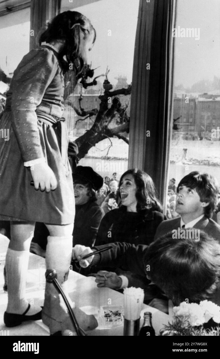 The Beatles sign the plastered leg of a young girl at Salzburg airport ...