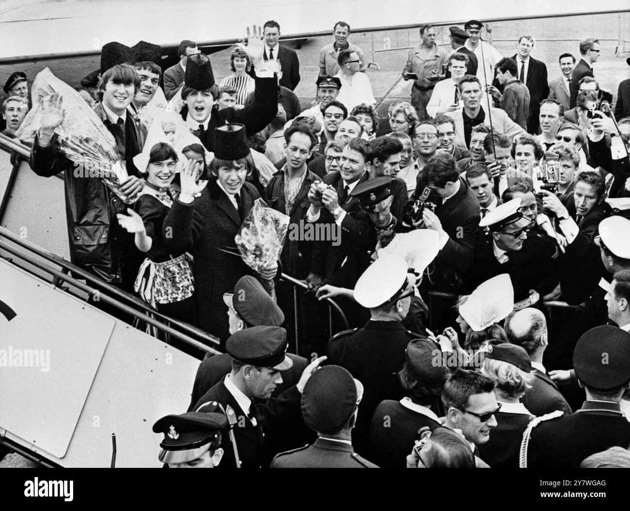 The Beatles wearing traditional Volendam Dutch hats on their arrival in ...