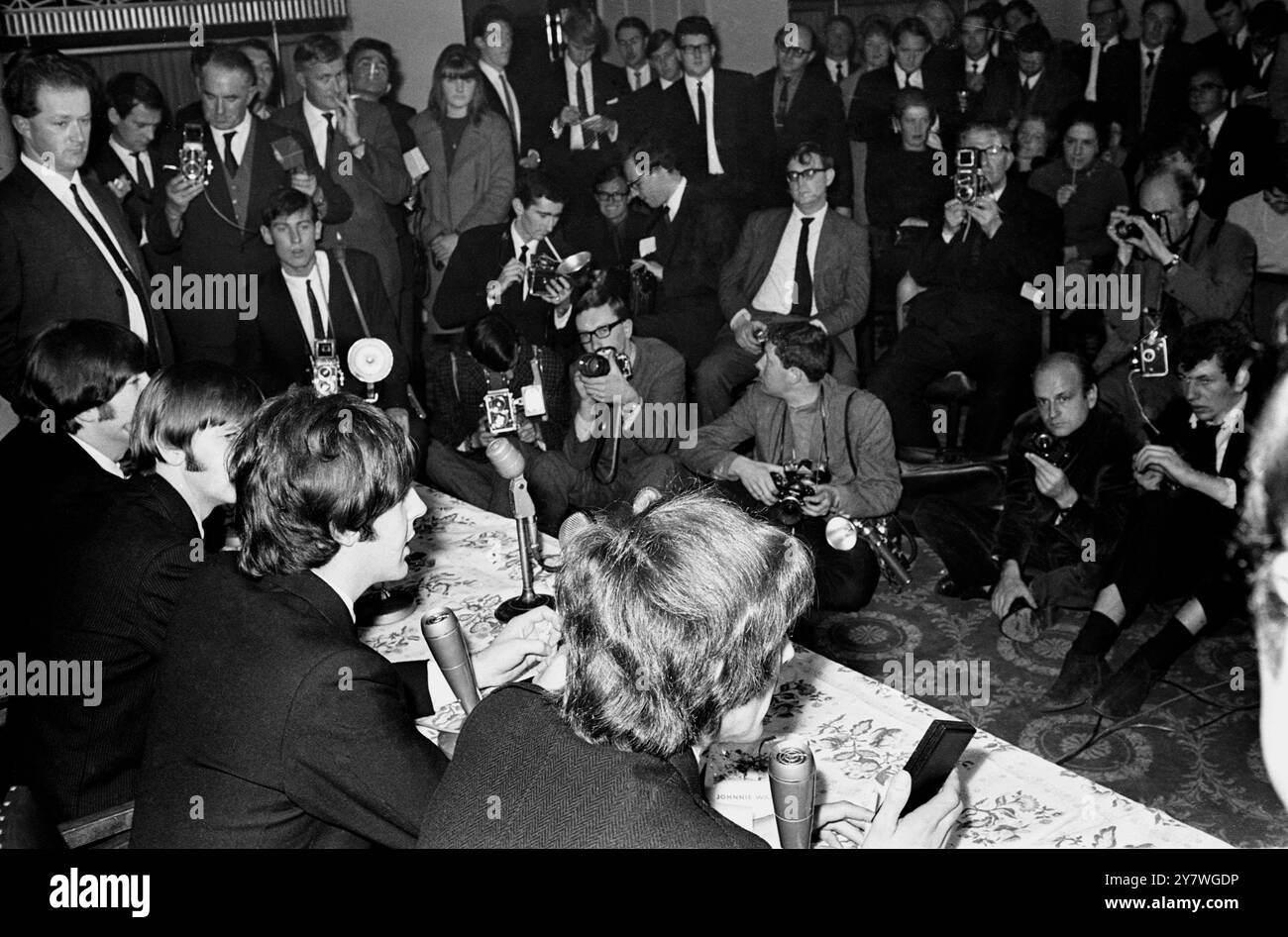 The Beatles at a press conference after receiving their MBE ' s at ...