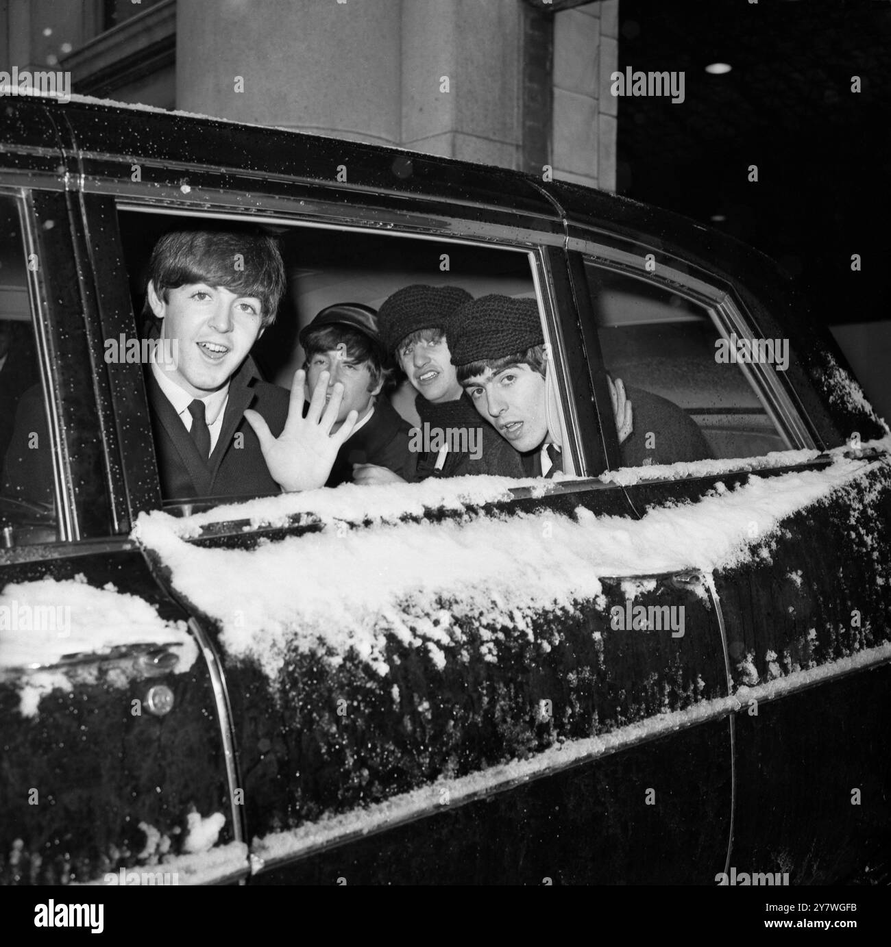 The Beatles arrive in the snow at Washington ' s Union Street station ...