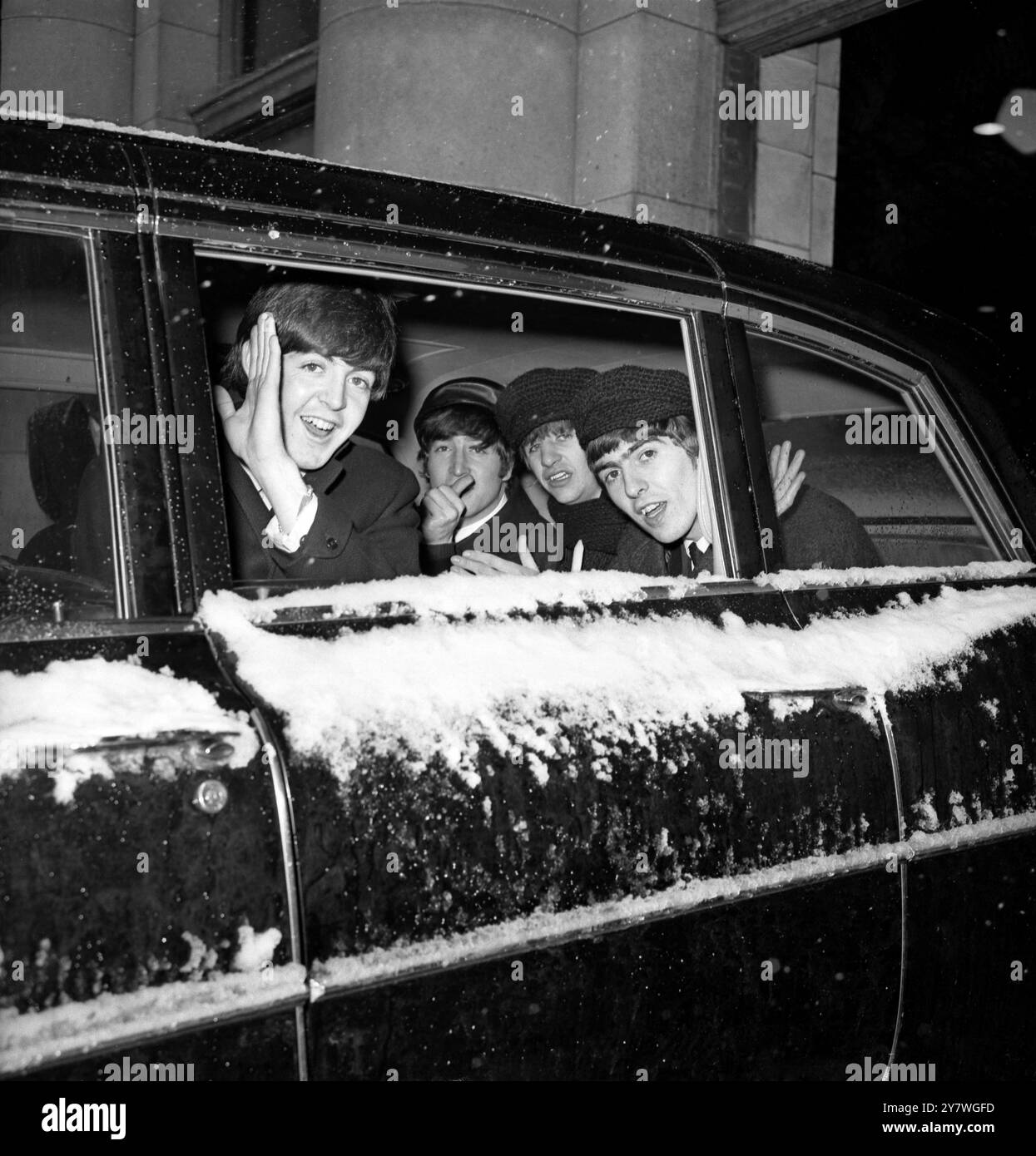 The Beatles arrive in the snow at Washington ' s Union Street station ...