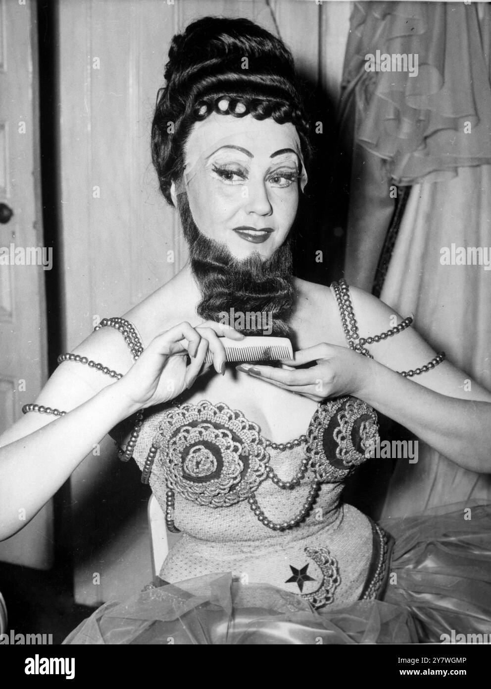 New York : Opera singer Blanche Thebom combs the luxurious whiskers she ...