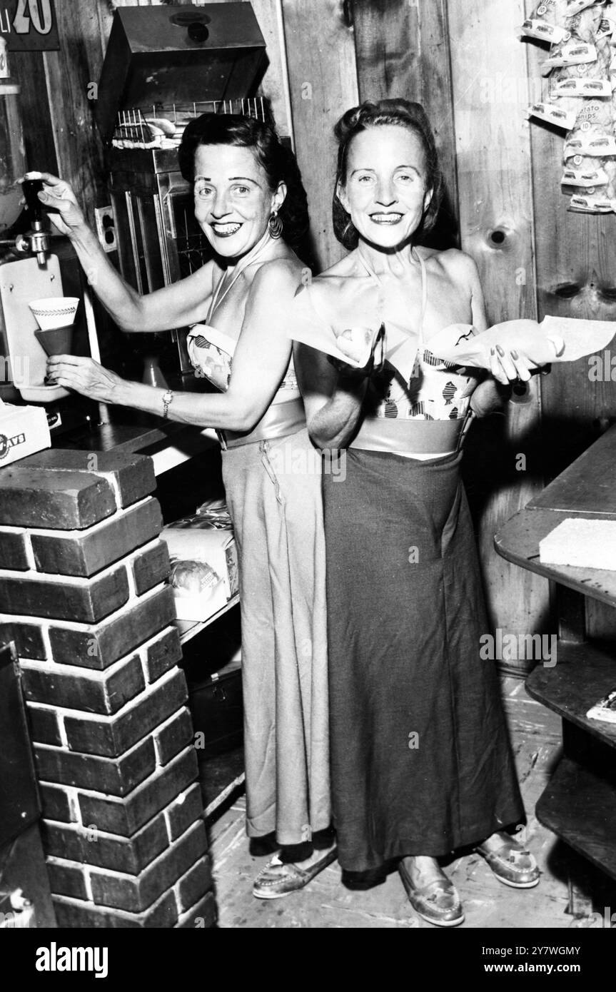 Siamese twin sisters Violet and Daisy Hilton working in their snack bar ...