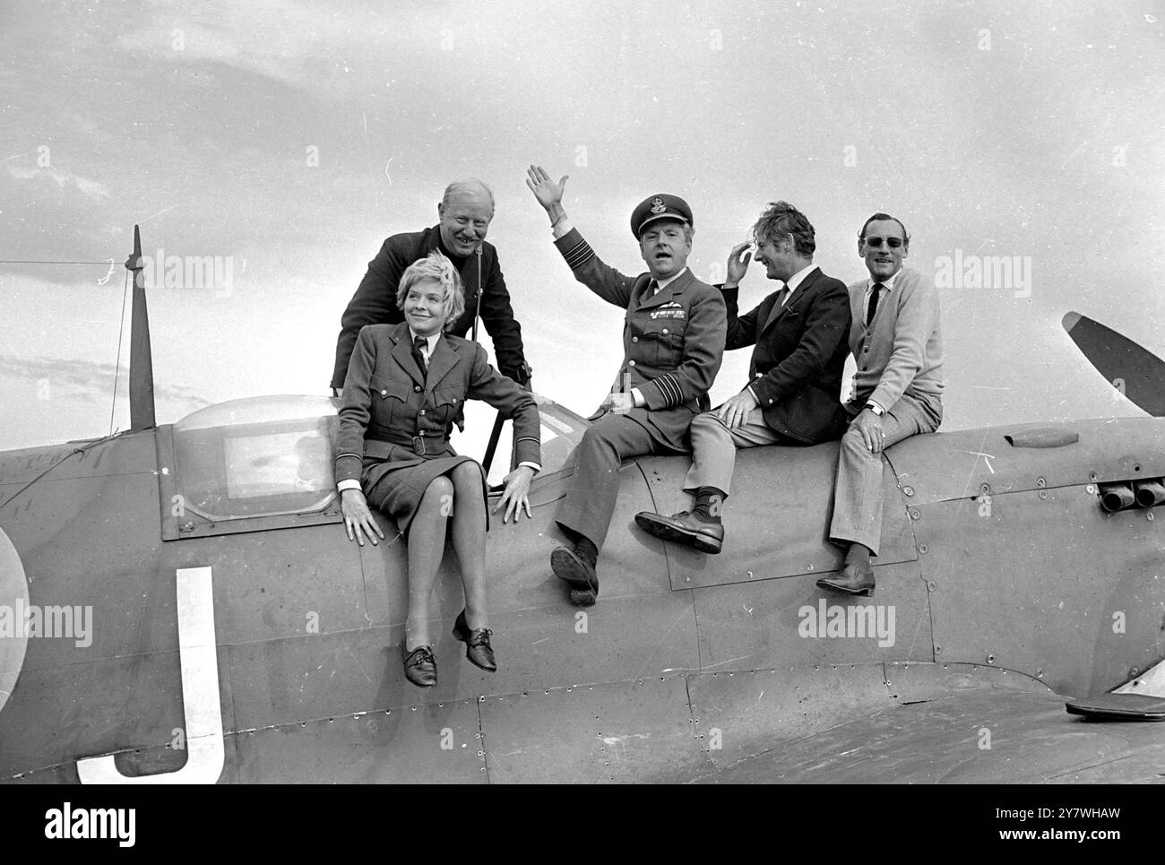 Duxford , Cambridgeshire : Sitting on a Spitfire during filming of ...