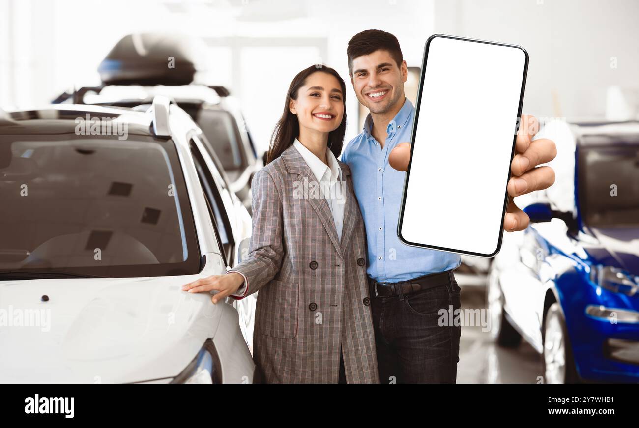 Family Showing Car Key Standing In Dealership Store Stock Photo - Alamy
