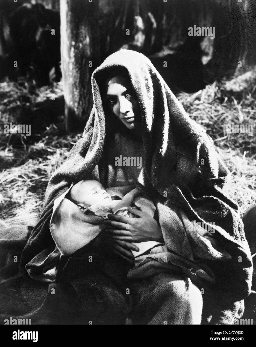 The Virgin Mary, played by actress Jose Greci, cradles the newborn baby ...