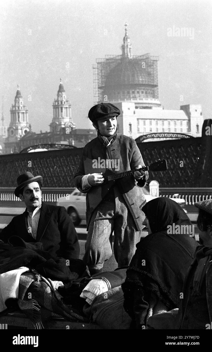 Playing a Balalaika on Blackfriars Bridge is Stephen leigh , the ...