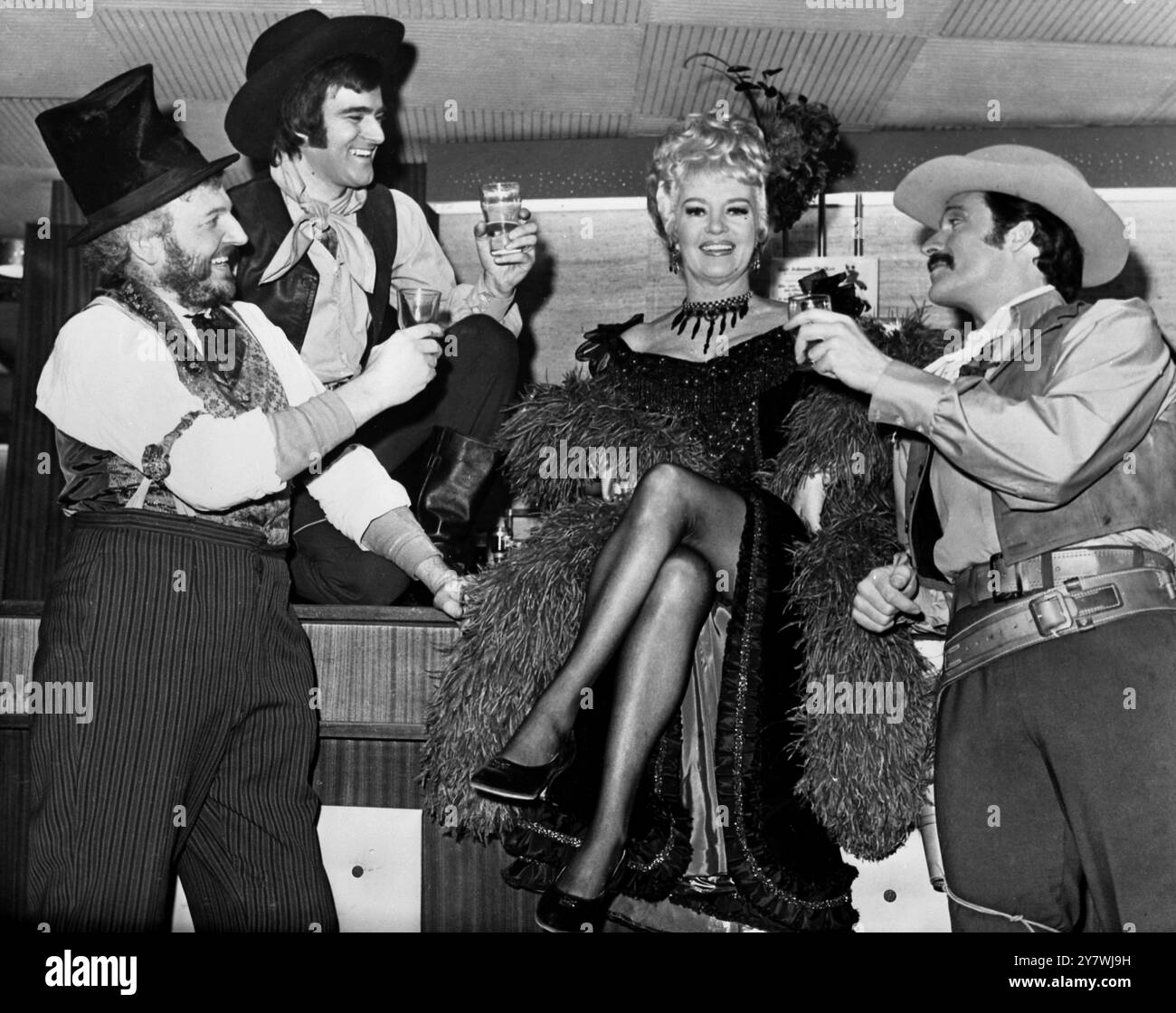 Raising their glasses to American film star Betty Grable are ( from ...