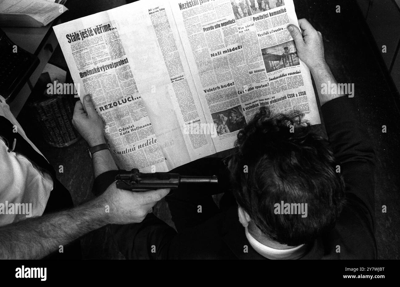 A Czech student reading the Malada Fronta newspaper , with a blank ...