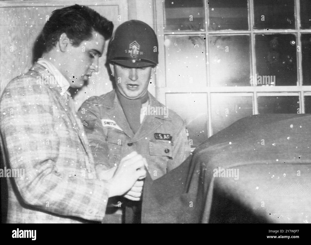Elvis Presley under the watchful eye of Corporal John D Smith, tackles ...