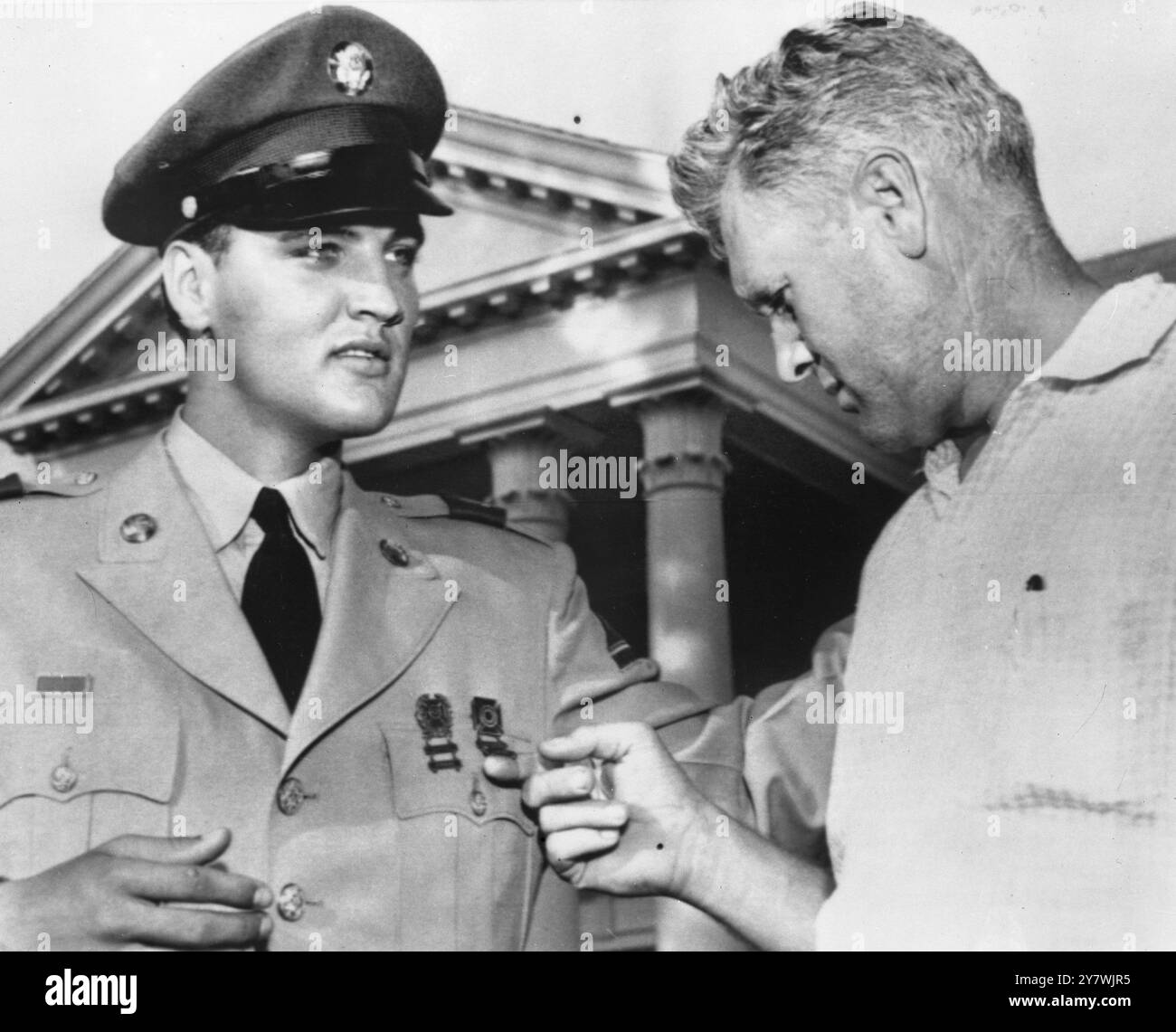 Elvis Presley with his father Vernon Presley who admires his son's ...