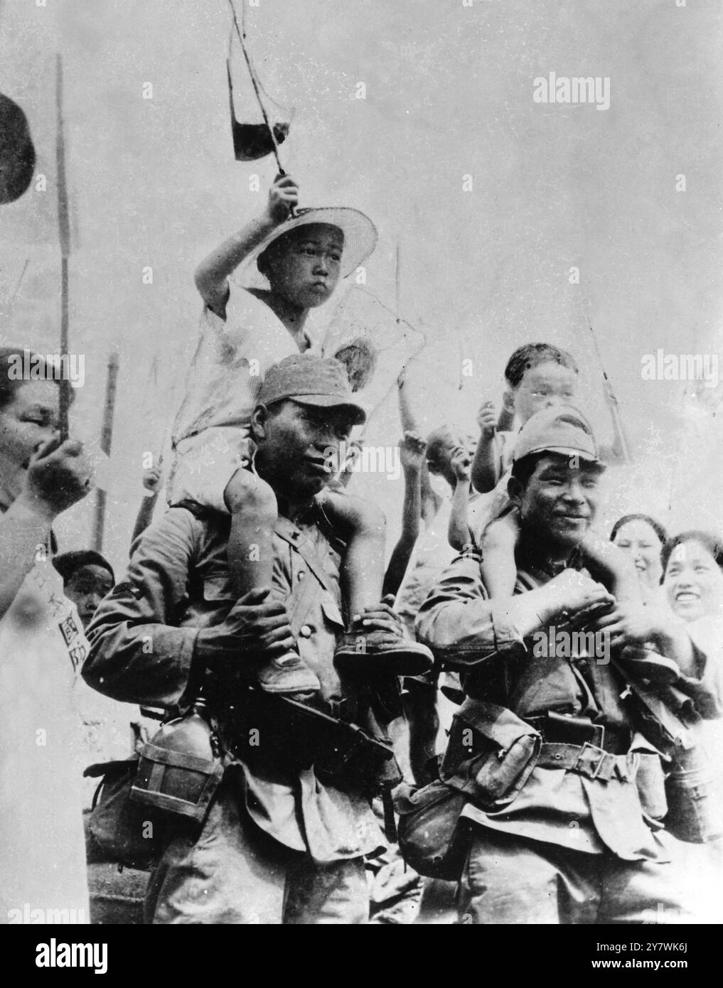 Japanese children cheer their advancing troops in North China ...