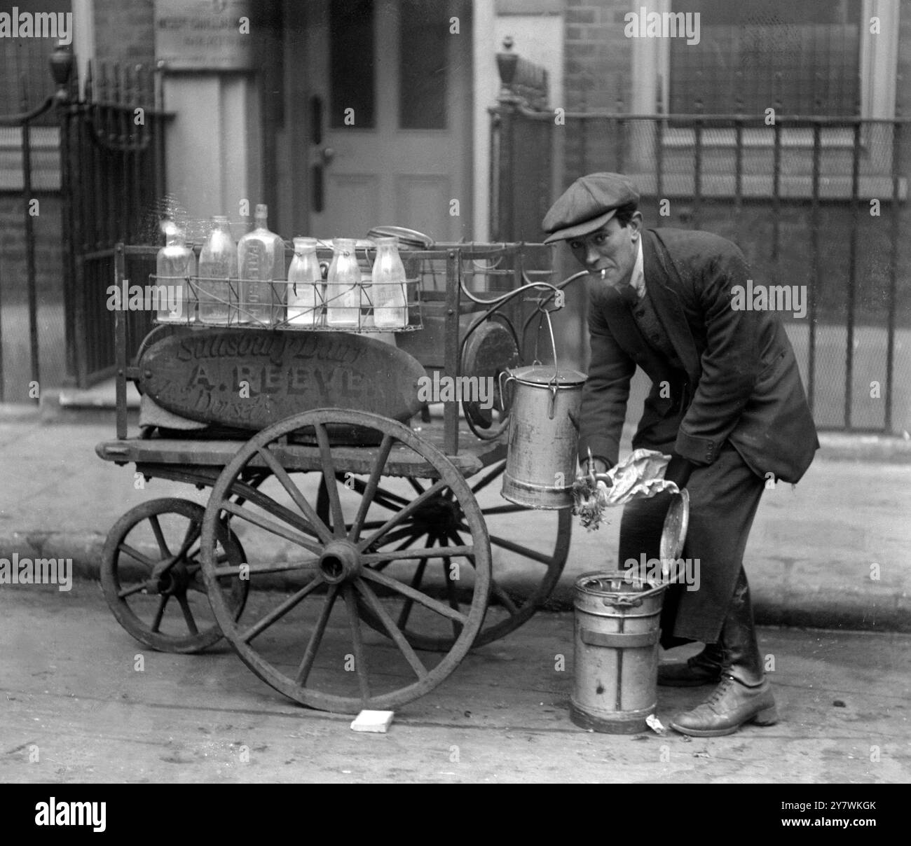 Cold weather scenes in London The Milkman thaws his milk in the streets ...