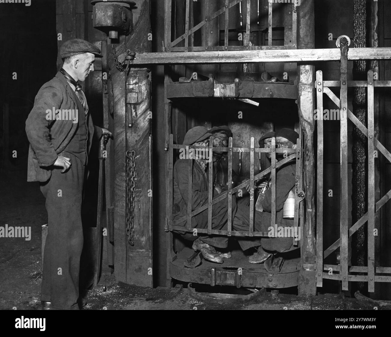 Coal miners coming up in the cage from the mine shaft - 1935 / 6 ...