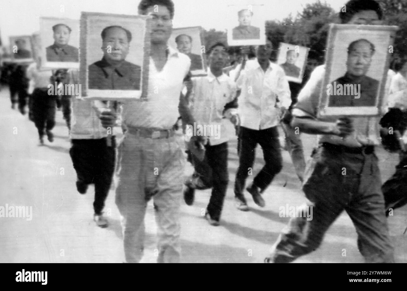 Peking , Red China : Holding portraits of Mao Tue-Tung , members of the ...