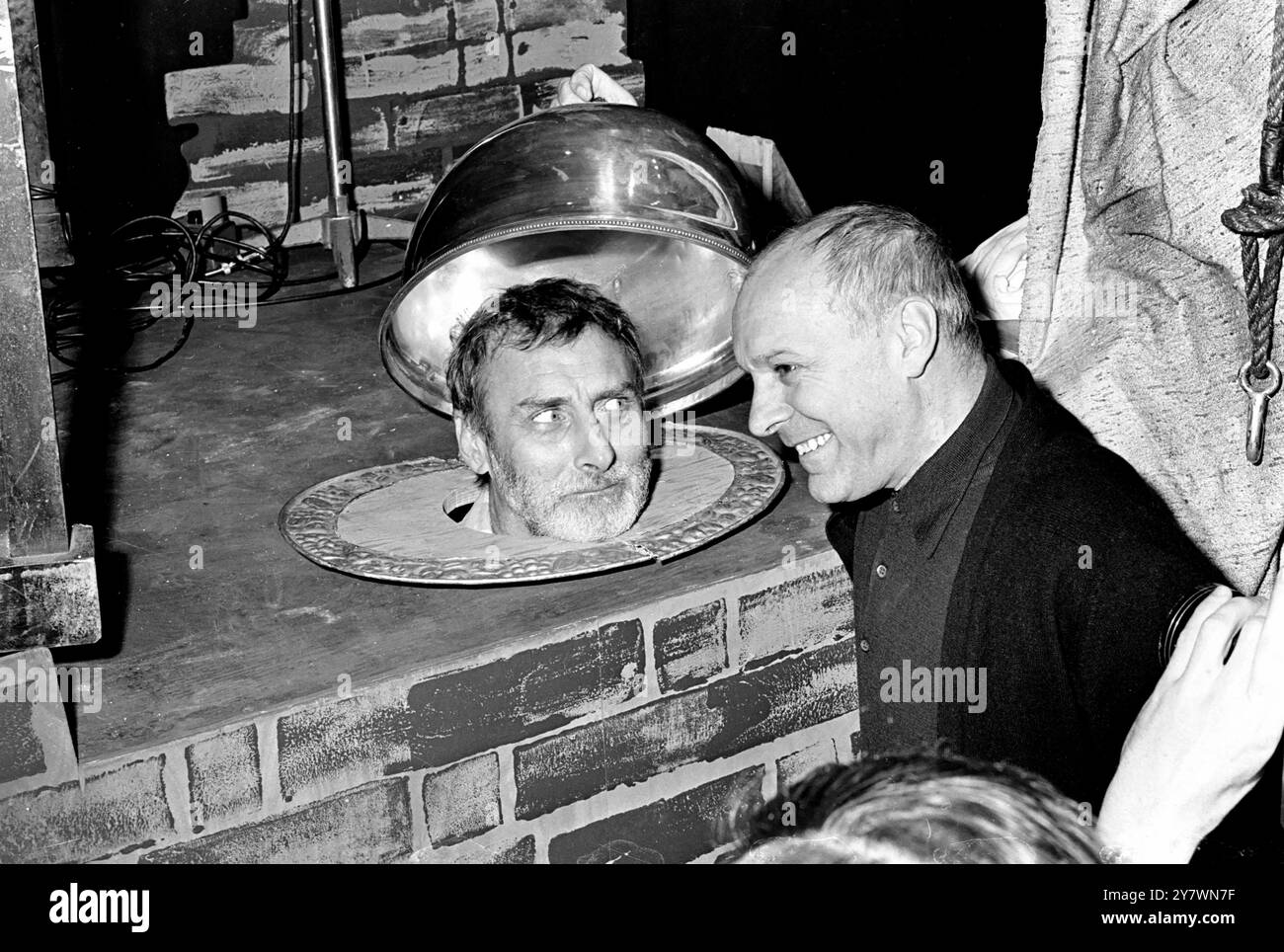 You lift up the lid and there itis the head of Spike Milligan . Holding ...