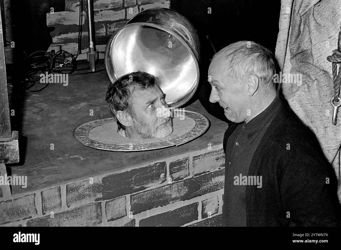 You lift up the lid and there itis the head of Spike Milligan . Holding ...