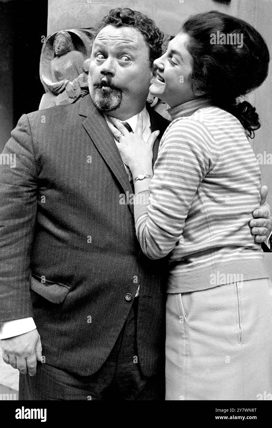 Comedian Harry Secombe receives some fond treatment from his mistress ...