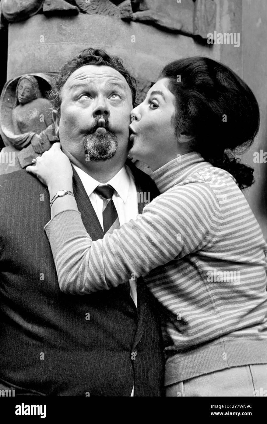Comedian Harry Secombe receives some fond treatment from his mistress ...