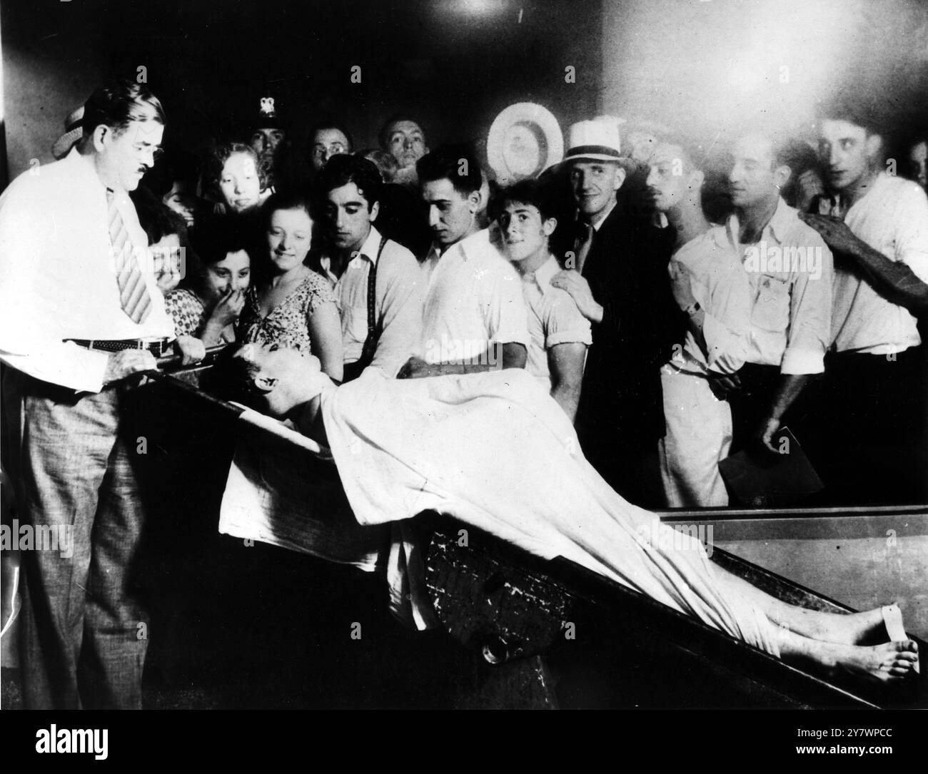 John Dillinger gives an exhibition in his glass enclosed icebox in the ...