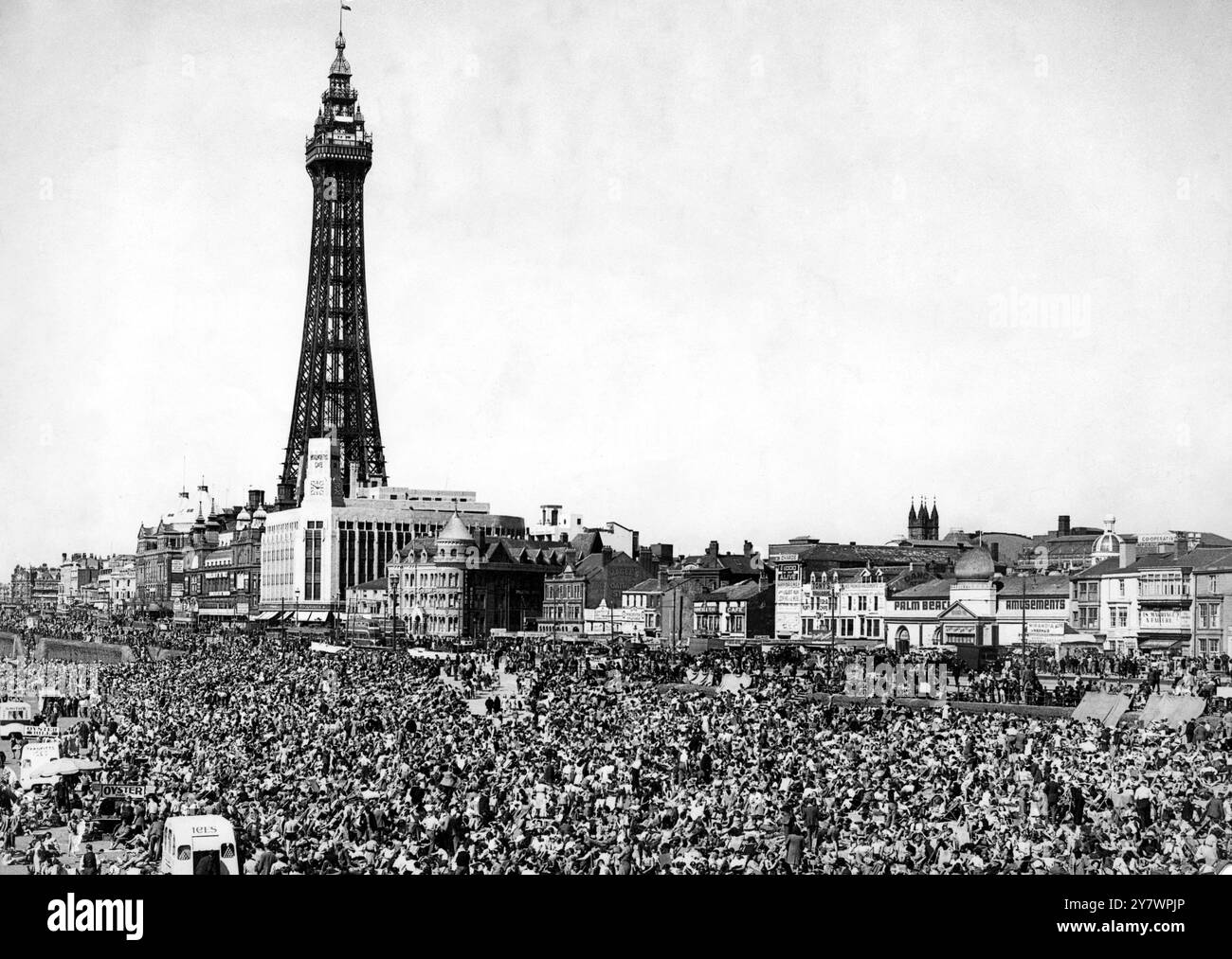 Thousands of holiday-makers are seen enjoying the first real break of ...