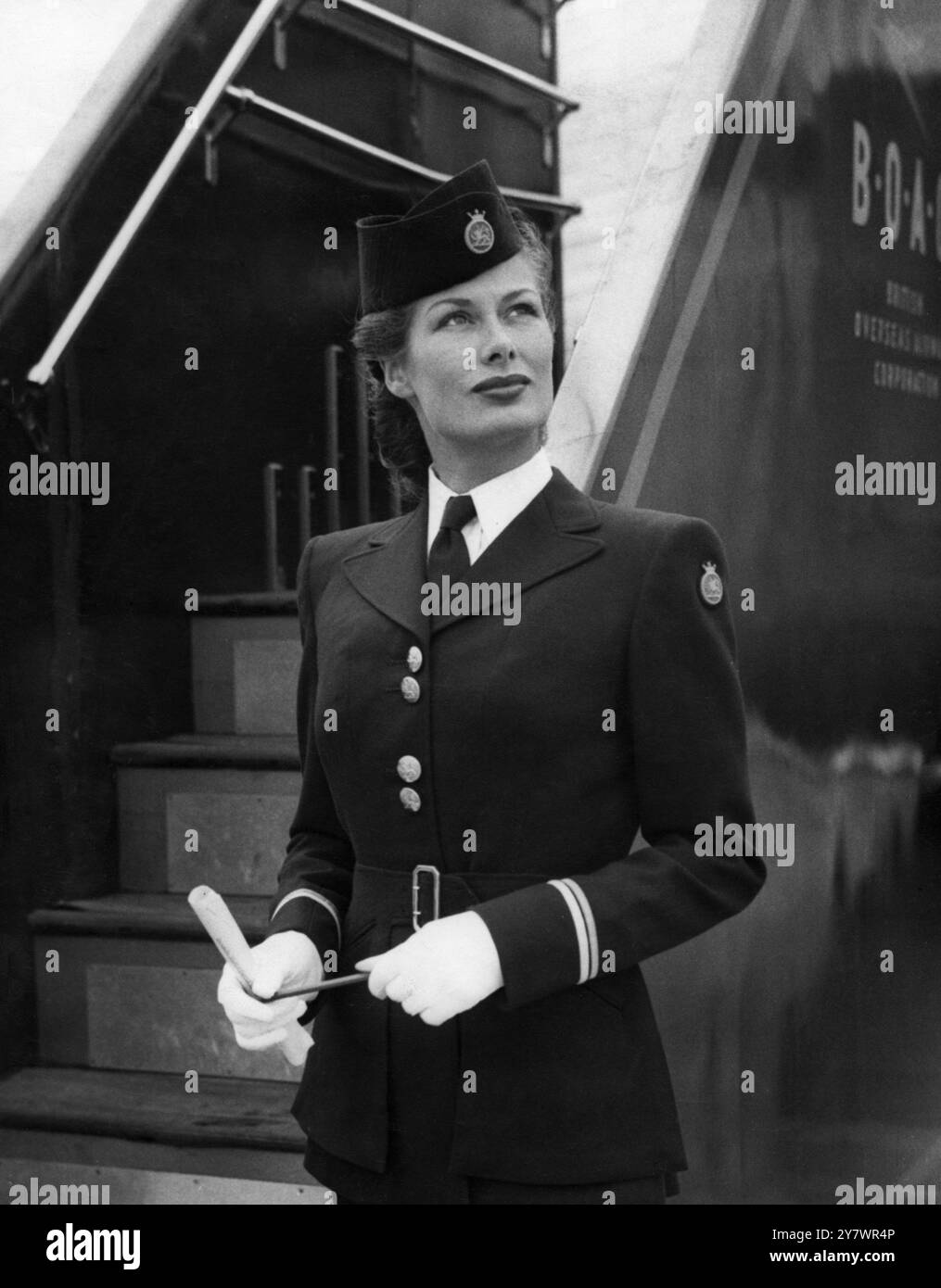 Smartness and charm of air stewardessess fo the BOAC are stepped up by ...