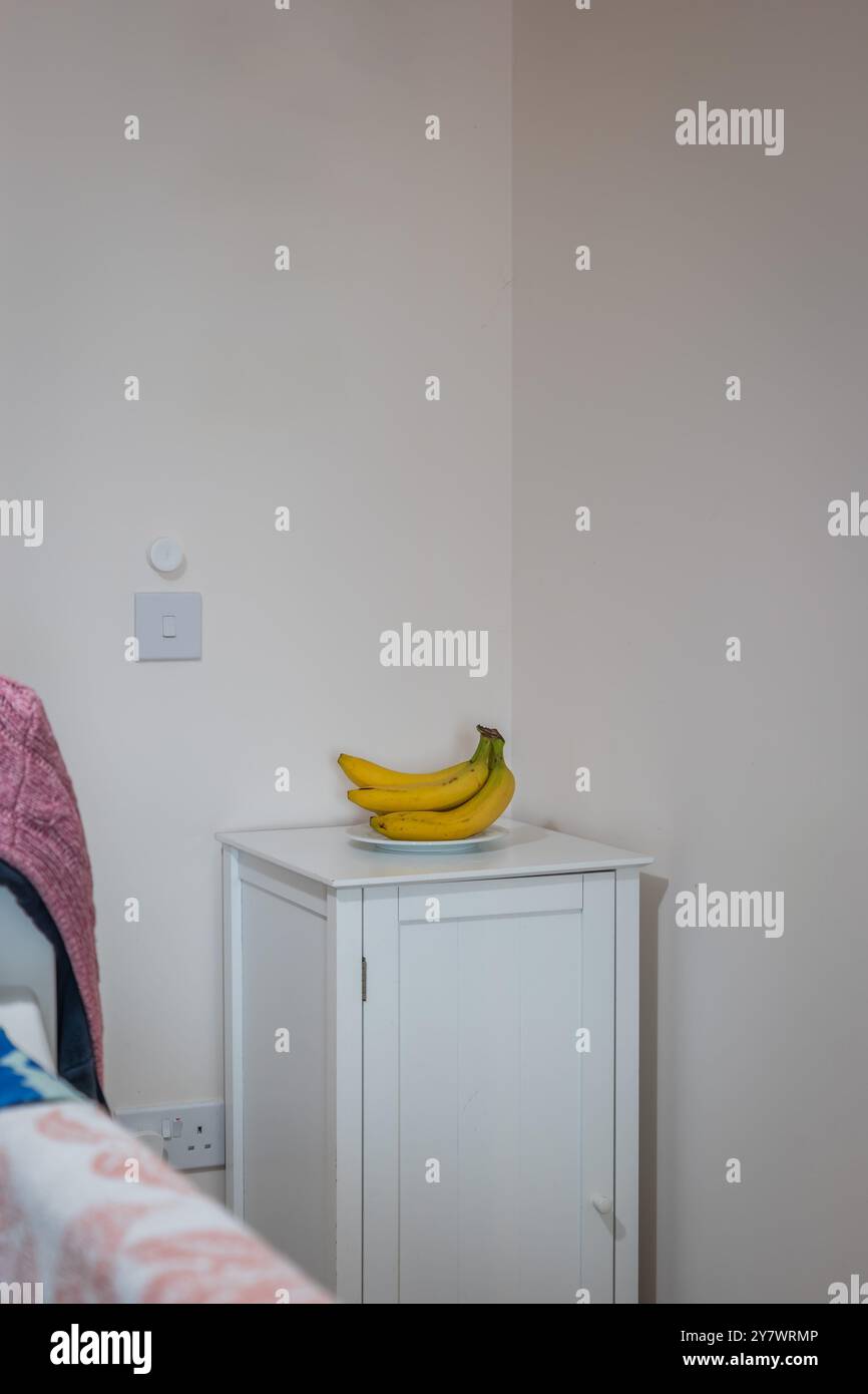 Fresh ripe banana fruit on corner table in hall Stock Photo - Alamy