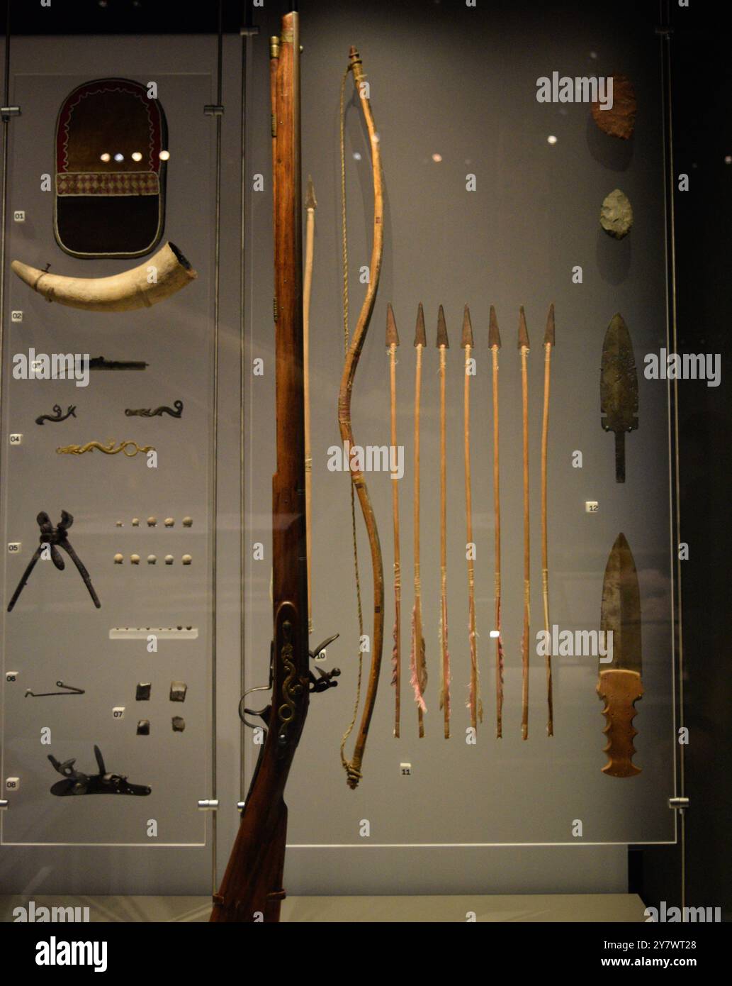 bows, spears, arrowheads, and a horn. Artifacts and weapons of early ...