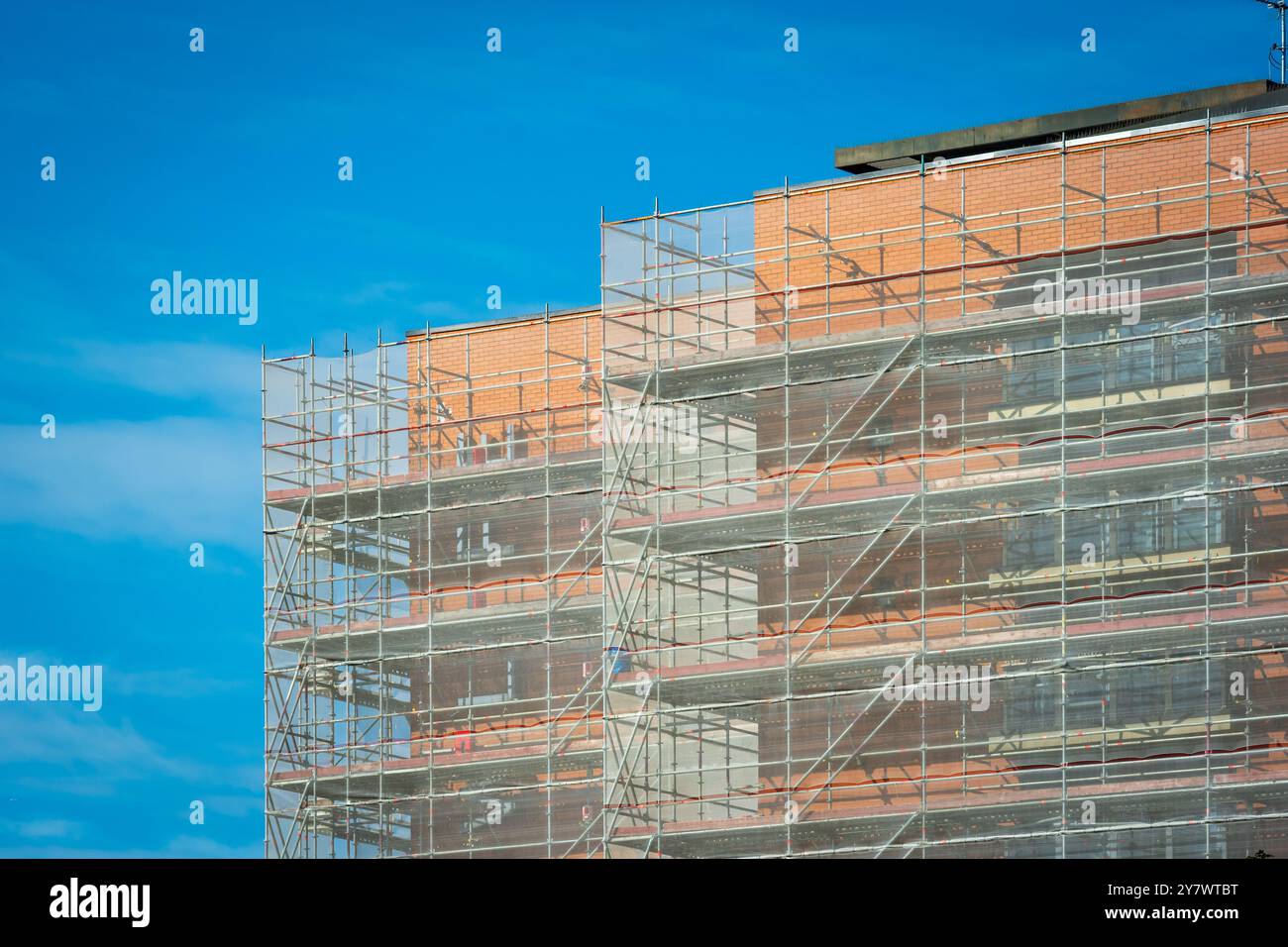 Scaffold sheeting net wrapped apartments building during insulation in ...